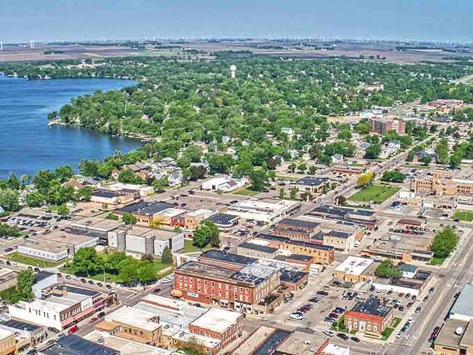A bird's-eye view of Worthington reveals its perfect balance—a charming downtown nestled alongside sparkling lake waters, where affordable living meets natural beauty.