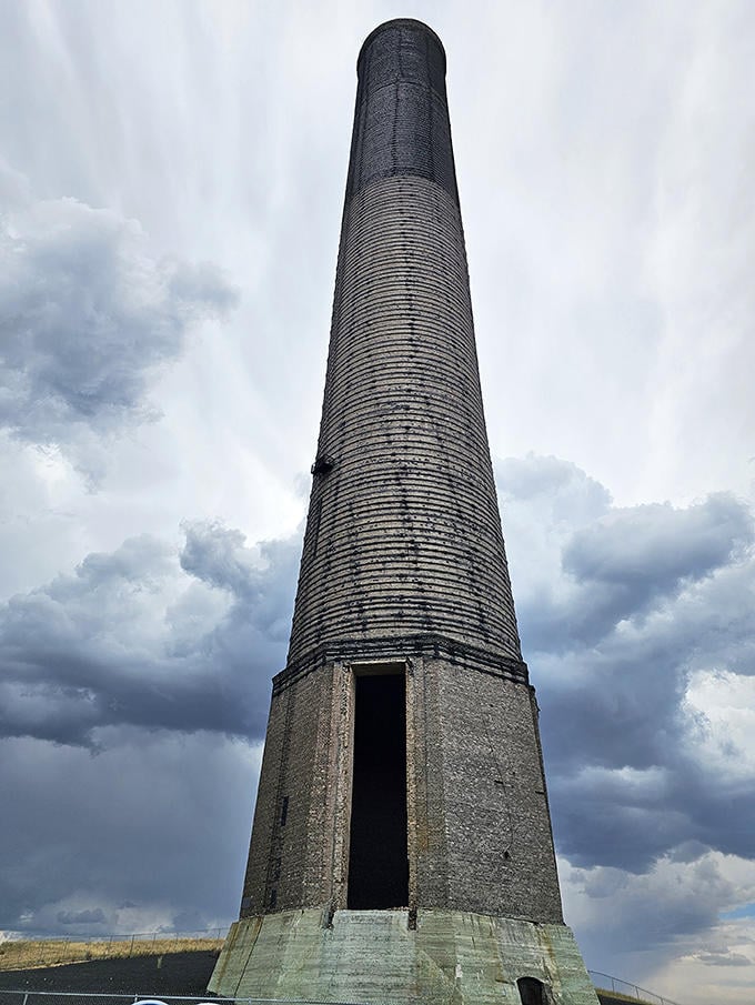 The iconic Washoe Stack stands sentinel over Anaconda, a 585-foot exclamation point marking where industry and history converge.
