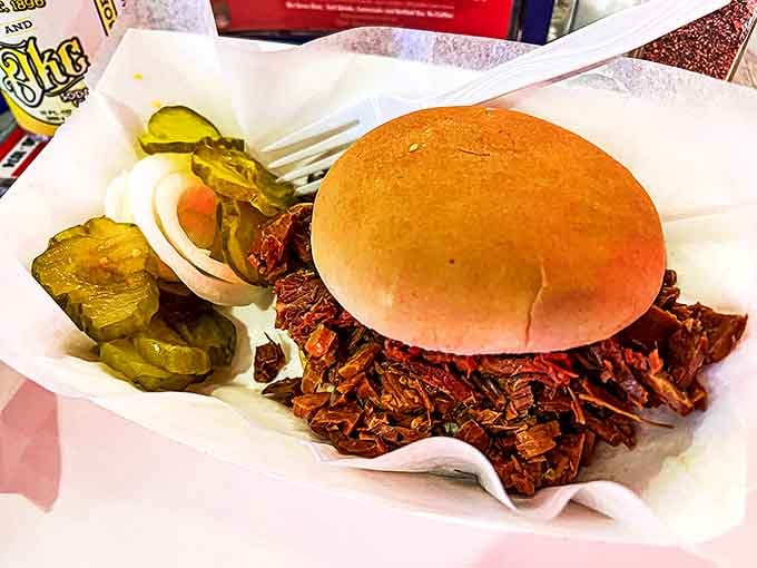 This BBQ beef sandwich isn't trying to win beauty contests &ndash; it's too busy making taste buds dance with tender meat piled high on a simple bun.