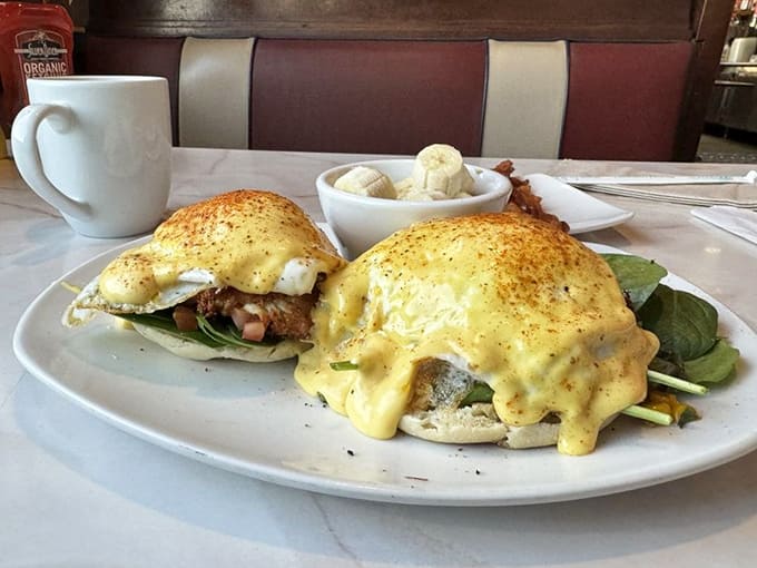 Eggs Benedict reimagined with a hollandaise so rich it should have its own tax bracket, served with fresh fruit that didn't come from a can.