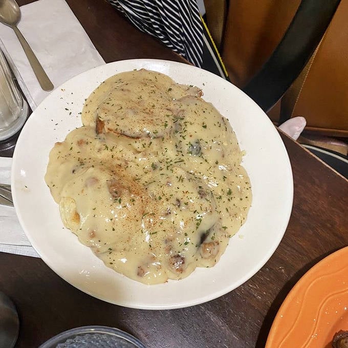 Biscuits and gravy that would make your Southern grandmother weep with joy. Comfort food perfection on a plate.