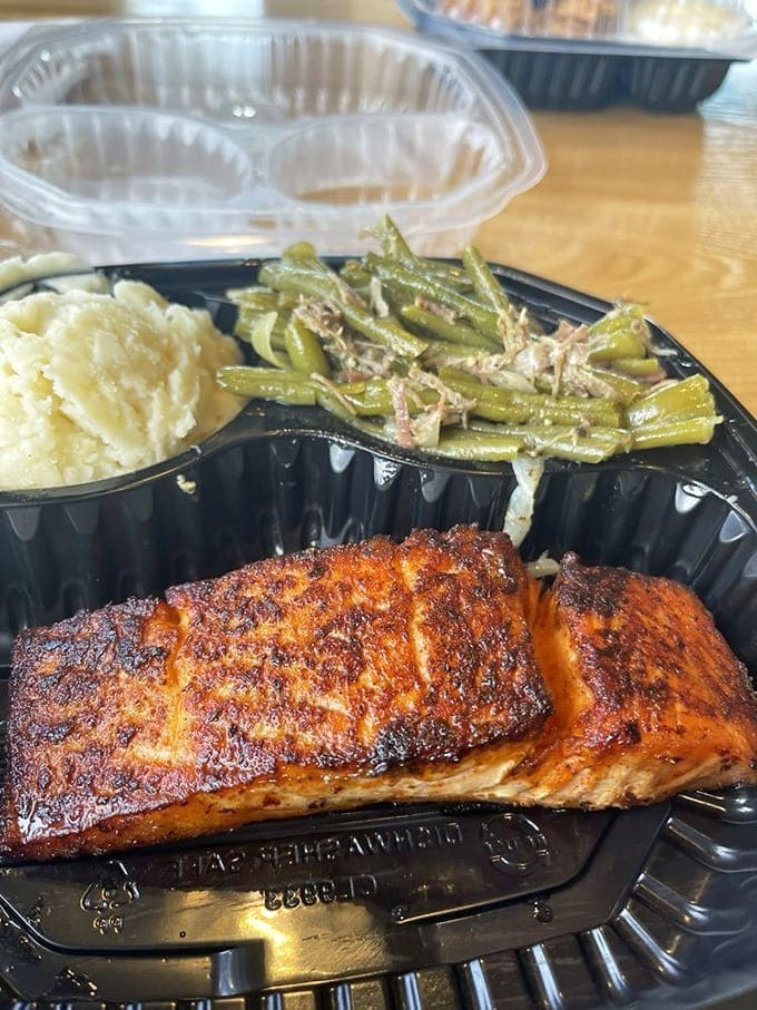 Blackened salmon that's wearing its spices like a perfectly tailored suit. Those green beans and mashed potatoes aren't just sides&mdash;they're supporting actors deserving their own award.