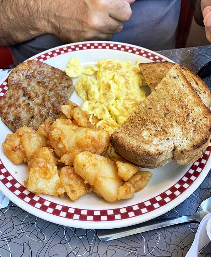 Breakfast perfection on a plate. The kind of home fries that make you want to high-five the cook and ask for their life story.