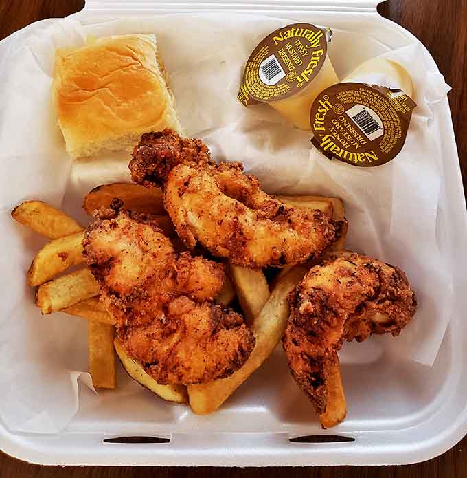 Southern comfort on a plate: chicken fingers that would make your grandmother nod in approval, paired with fries that never met a frozen bag.