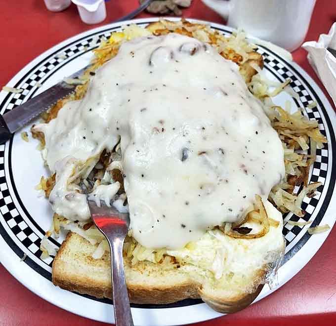 Beneath that blanket of peppery gravy lies a breakfast that could fuel a farmhand through harvest &ndash; or you through a particularly challenging Tuesday.