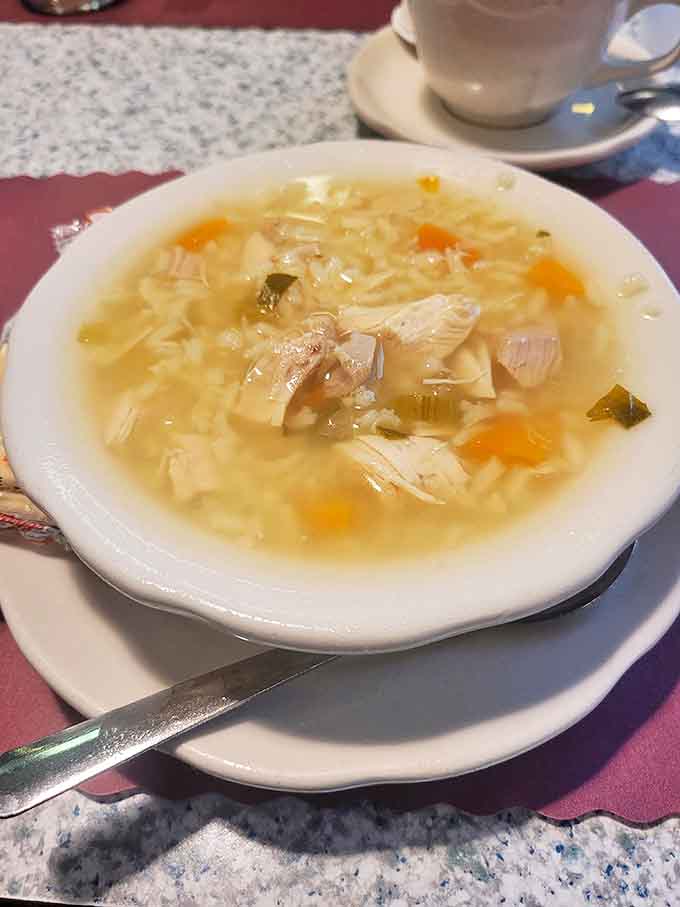 A bowl of chicken soup that could give your grandmother's recipe a run for its money—clear broth, tender chicken, and perfect pasta.