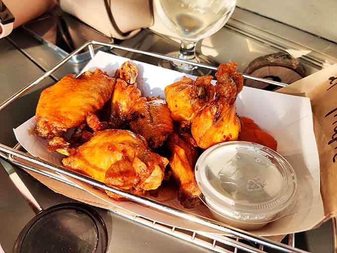 Golden-brown chicken wings that crackle with each bite, served with cooling dip&mdash;proof that simple pleasures can reach transcendent heights.