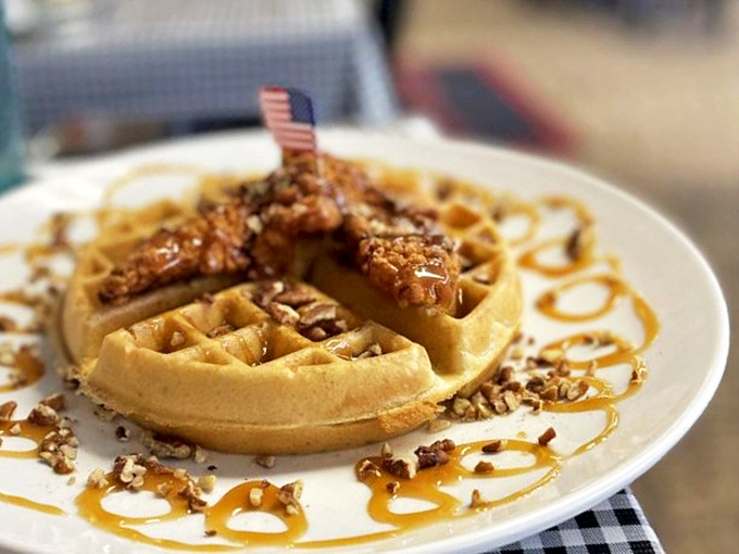 This isn't just a waffle—it's a golden throne for that perfectly crispy chicken, crowned with pecans and caramel that'll make you forget your name.