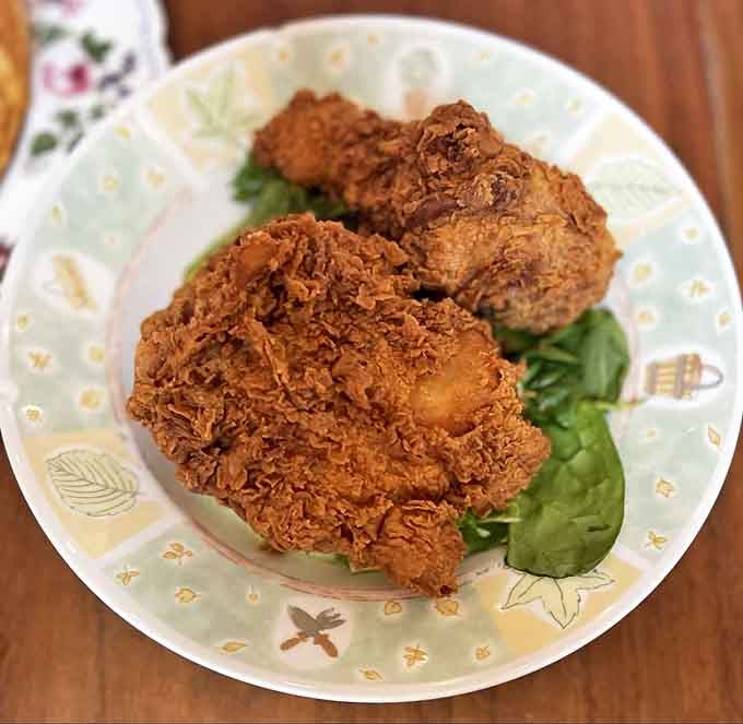 Fried chicken with a crust so perfectly golden and crunchy, it deserves its own Instagram account and possibly a small parade.