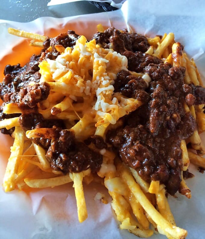 Chili cheese fries that don't mess around &ndash; a mountain of crispy potatoes buried under an avalanche of savory chili and melted cheese.