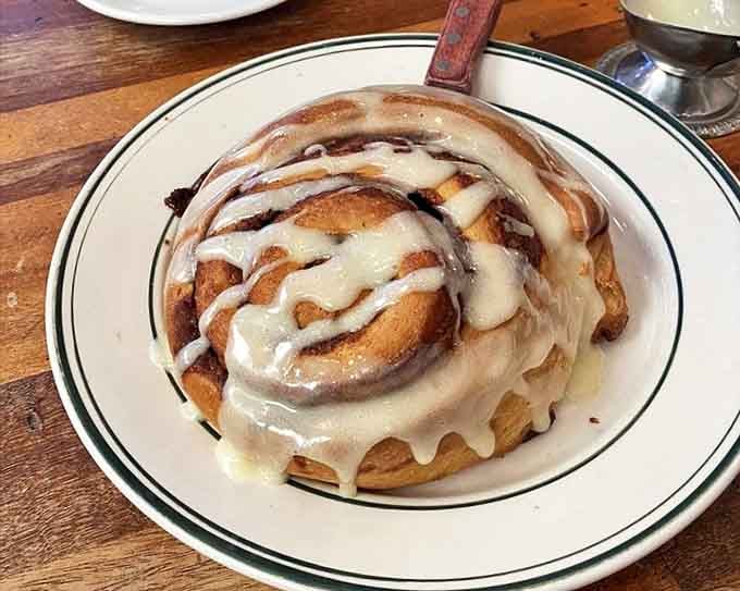 This cinnamon roll isn't just breakfast, it's an event &ndash; a spiral of joy topped with icing that melts down the sides like a sweet avalanche.