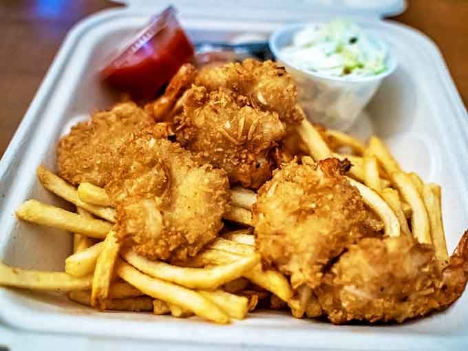 Golden-crusted coconut shrimp that would make Neptune himself swim to shore. Crispy outside, tender inside &ndash; the seafood equivalent of a perfect first date.