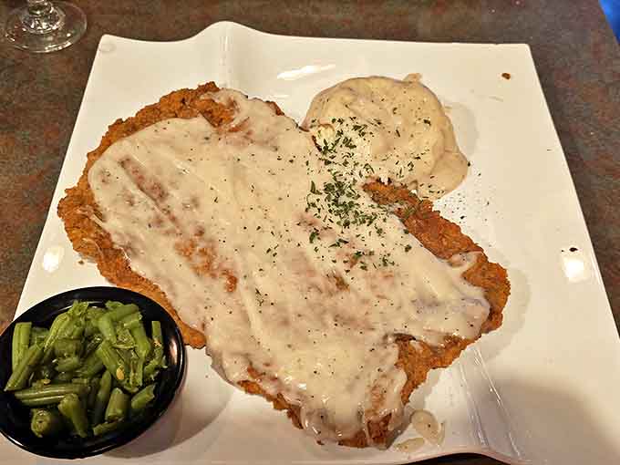 Country-fried steak smothered in creamy gravy that your grandmother would approve of, paired with green beans that haven't forgotten their Southern roots.