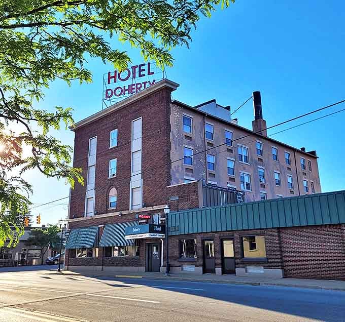 The brick facade of Hotel Doherty has witnessed generations of Clare stories, standing tall as the town's most recognizable landmark.