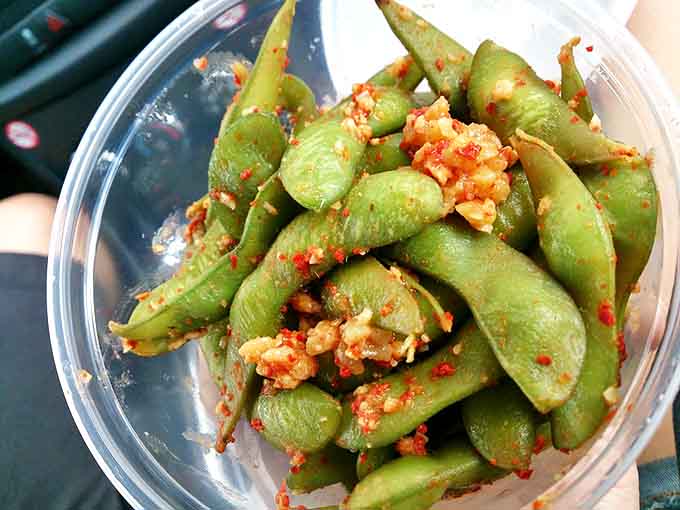 These garlic-spiced edamame pods aren't just a side dish—they're little green vessels of joy that'll have you licking your fingers shamelessly.