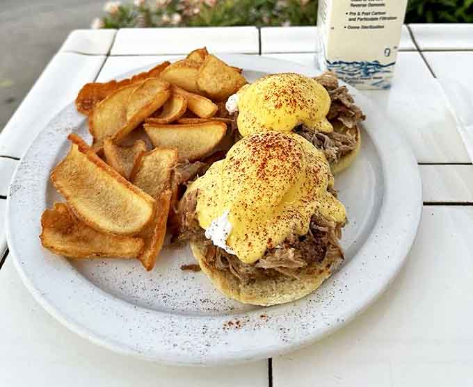 Eggs Benedict reimagined with pulled pork that would make even the most dedicated cardiologist take a cheat day. Worth every delicious calorie.