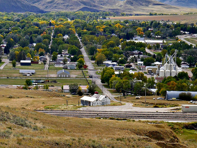 Bird's eye view of small-town serenity. Those grain elevators aren't just landmarks&mdash;they're the town's economic heartbeat.