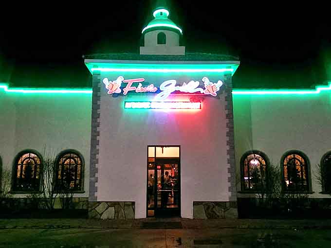 Fiesta Grill glows with neon promise after sunset, a beacon of sizzling fajitas and margaritas that brighten Mississippi evenings.