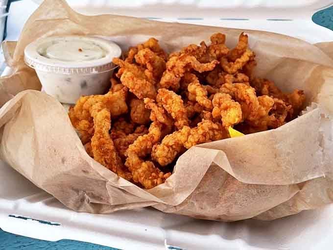 Golden-fried clam perfection that makes you wonder why anyone would eat anything else. The crispy exterior gives way to briny sweetness.