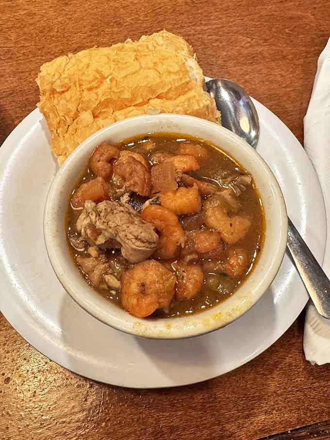 This isn't just gumbo; it's Louisiana's history in a bowl. Each spoonful delivers a depth of flavor that makes you wonder if they've somehow distilled time itself.