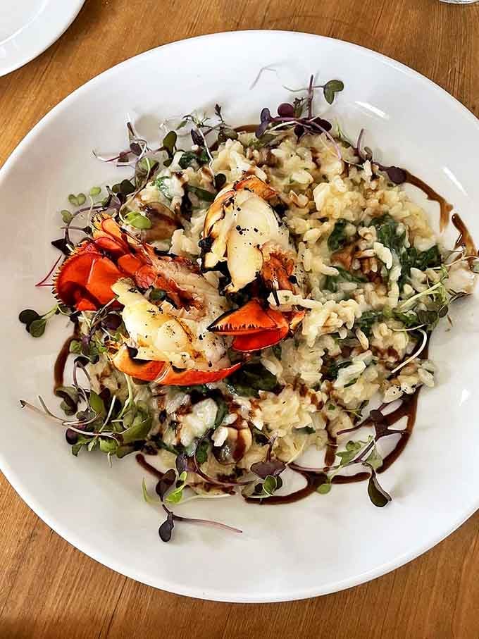 Lobster risotto that makes you want to write poetry. The delicate balance of creamy rice and sweet lobster meat is nothing short of culinary magic.