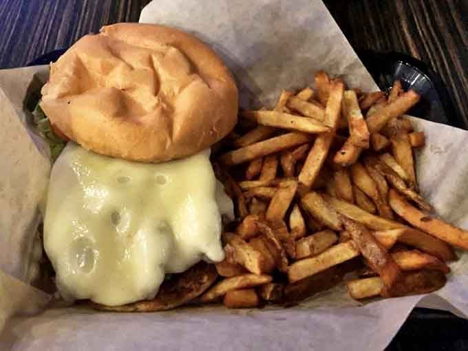 This isn't just a burger &ndash; it's architecture with cheese, a monument to the art of comfort food that demands reverent silence with each bite.