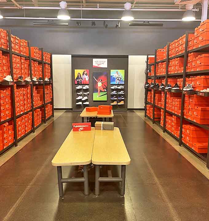 The Nike store's orange box kingdom stretches to the horizon, a sneakerhead's dream where athletic aspirations meet fashion reality.
