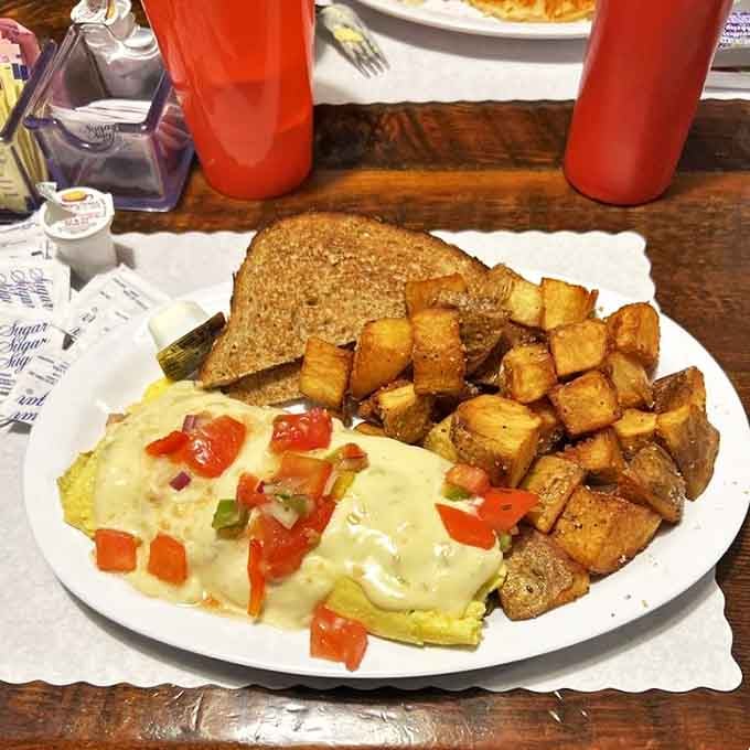 This isn't just an omelet; it's an edible postcard from flavor country, where vegetables and cheese have formed a delicious alliance.