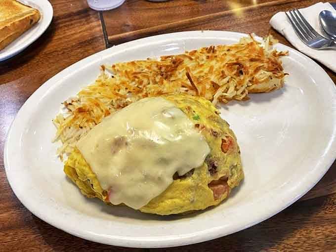 An omelet so perfectly executed it deserves its own trophy, with hash browns that achieve the ideal crisp-to-tender ratio.