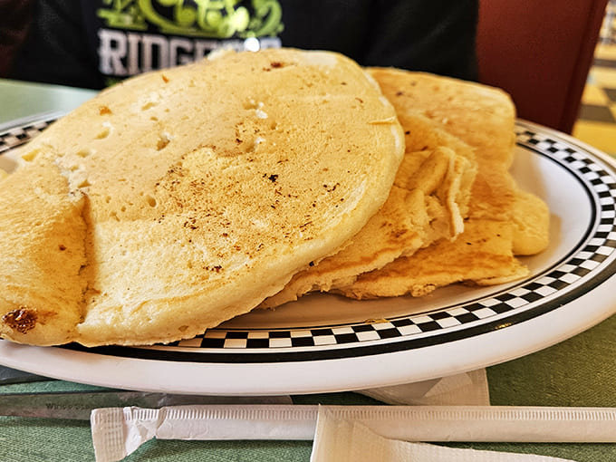 Pancakes so fluffy they practically hover above the plate. Golden discs of joy that make you understand why Vermont maple syrup exists.