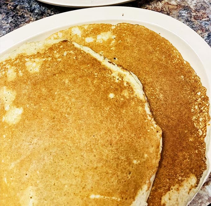 These golden pancakes aren't just breakfast, they're edible sunshine&mdash;perfectly browned discs waiting to soak up maple syrup like they were engineered for the job.