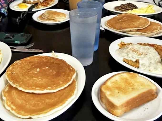 Golden pancakes that make you question why anyone would waste calories on lesser breakfast options. The toast stands by, knowing its supporting role.