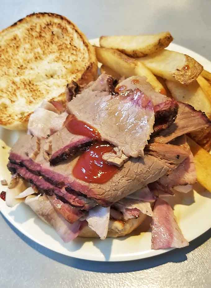 A proper BBQ sandwich should require both hands and at least three napkins. This beautiful mess meets all requirements with flying colors.