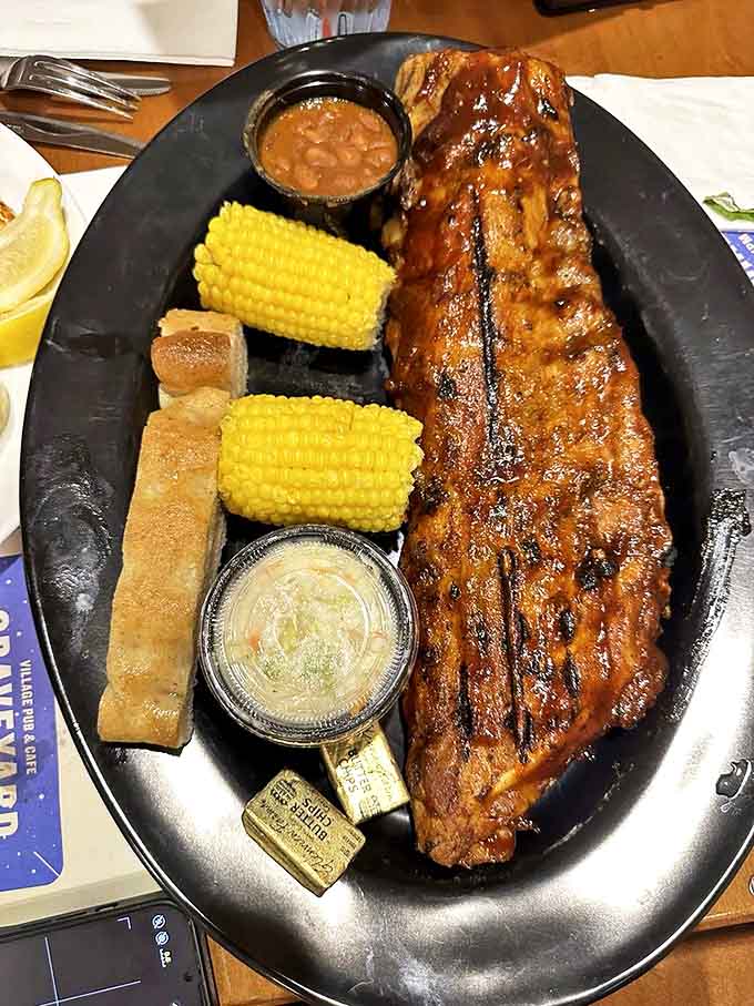 These ribs aren't messing around. Glistening with sauce and paired with corn on the cob – a plate that demands both hands and extra napkins.