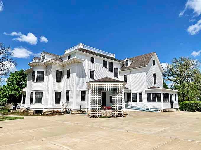 The Seelye Mansion stands proudly in pristine white, a testament to when architectural details weren't extras but essential expressions of home.