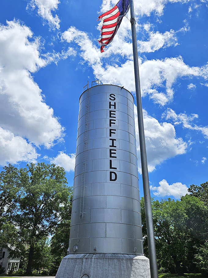 Sheffield's iconic water tower stands tall against a perfect blue sky, proudly displaying the city's name like a beacon to travelers passing through.