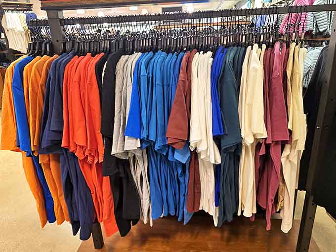 A rainbow of casual wear hangs in perfect formation, like a colorful army ready to march into your wardrobe at half the expected price.