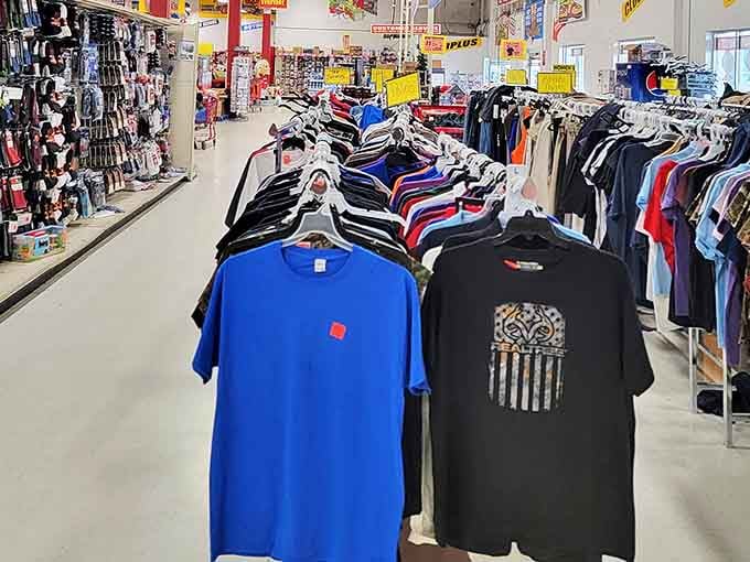 The clothing racks tell tales of retail rescue missions, where perfectly good T-shirts escaped their original high-priced destiny for your bargain-hunting pleasure.