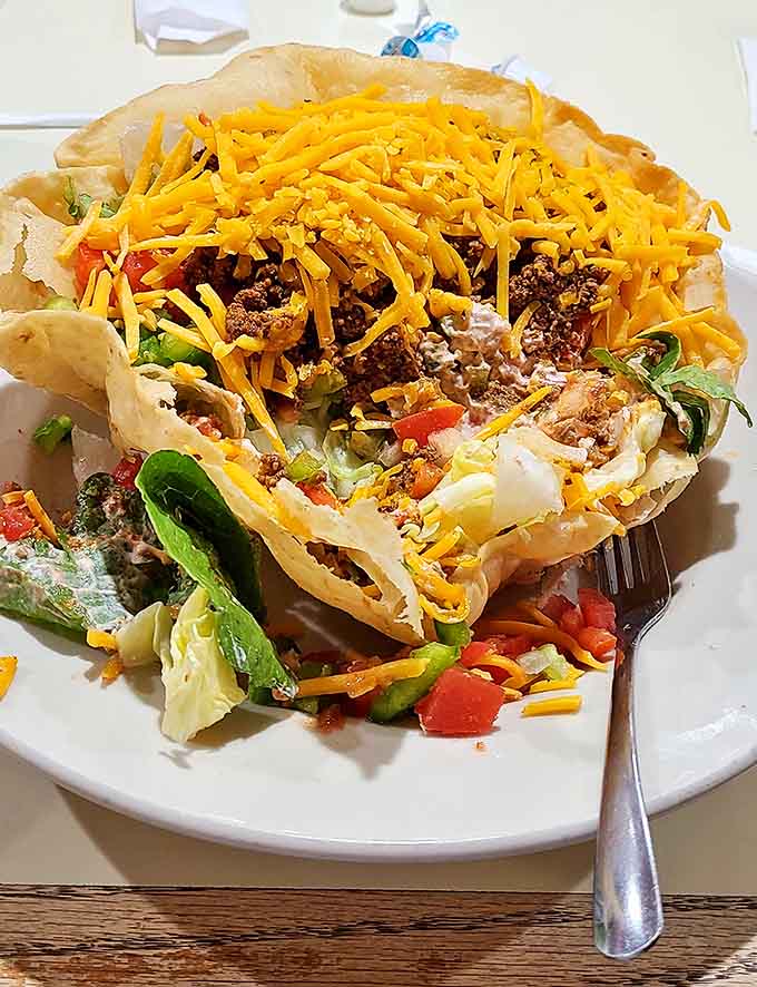 This taco salad doesn't know it's supposed to be health food, arriving as a glorious mountain of cheese, meat, and just enough lettuce to maintain plausible deniability.