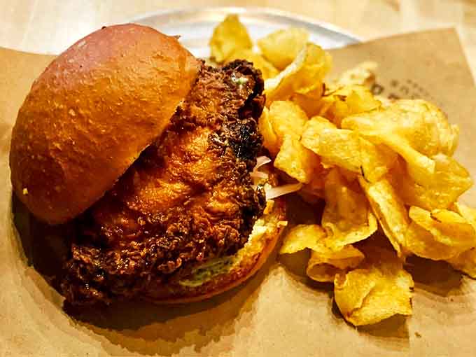 The Vietnamese Fried Chicken sandwich brings Saigon to Sioux Falls&mdash;crispy, golden perfection nestled in a bun with chips that crackle with each bite.