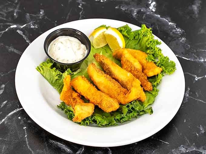 Golden walleye strips perched on crisp lettuce&mdash;proof that South Dakota knows its way around freshwater delicacies. The dipping sauce is just showing off.
