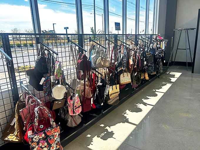 Handbag heaven! A rainbow of purses and totes dangles in the sunlight, each one with stories to tell and space for new adventures.