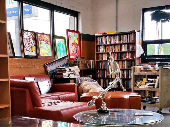 The impromptu library corner pairs leather seating with well-loved books &ndash; intellectual ambiance at yard sale prices.