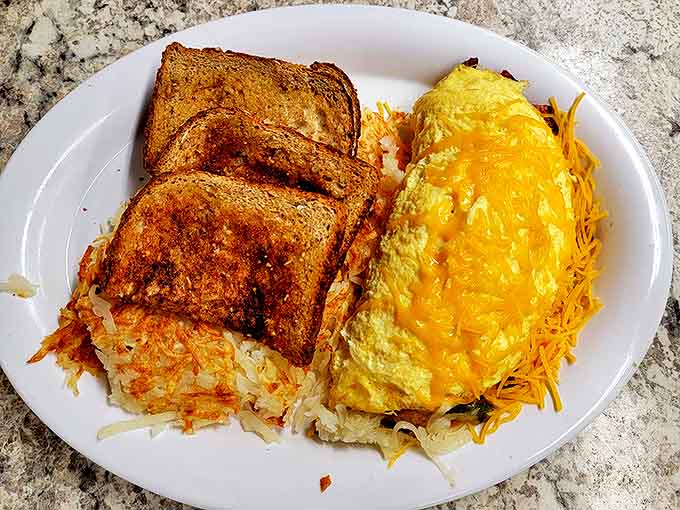 An omelet that's been lifting weights, served with toast that's achieved the perfect golden-brown tan. This is what breakfast aspiration looks like.