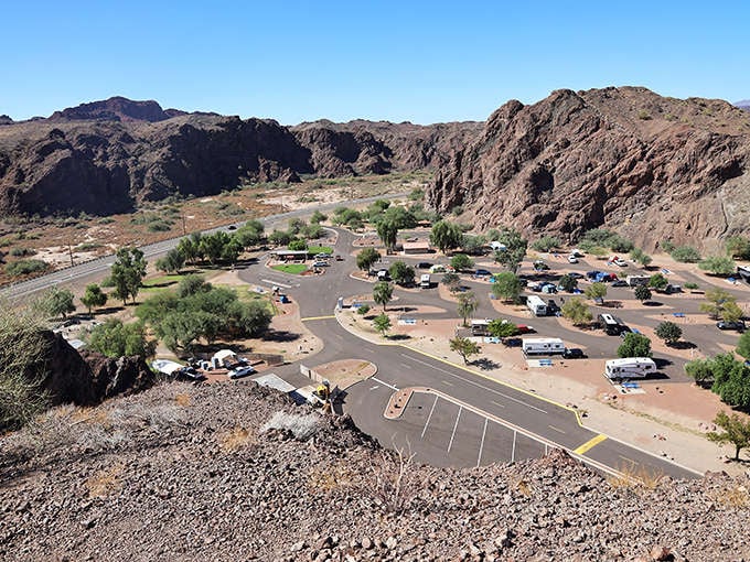 RV paradise with a view that beats any five-star hotel wallpaper. The campground nestles perfectly between mountain and river.