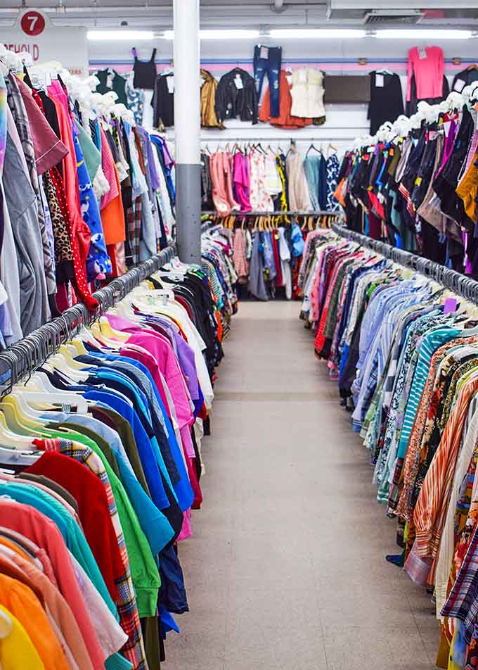 A rainbow explosion of fabrics and styles spanning decades of fashion history. From "what were they thinking?" to "that's actually back in style now" – all in one colorful aisle.