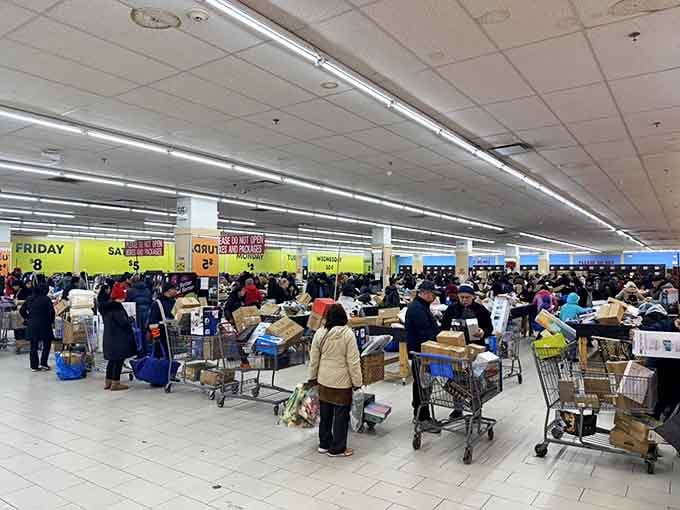 Bargain fever in full swing. The checkout line resembles a friendly convention of savvy shoppers who've all discovered the same money-saving secret.