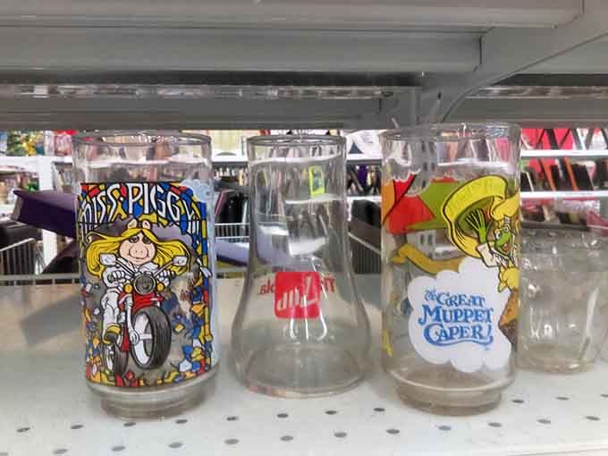Collector glasses that tell stories of forgotten promotions and childhood memories. That Muppet Caper glass probably served countless chocolate milks in 1981.