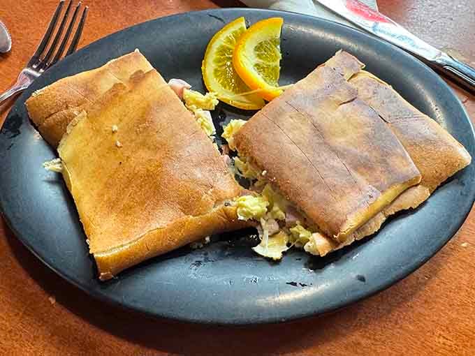 Breakfast becomes portable perfection &ndash; golden-brown crepe pockets holding the morning essentials that make getting out of bed worthwhile.