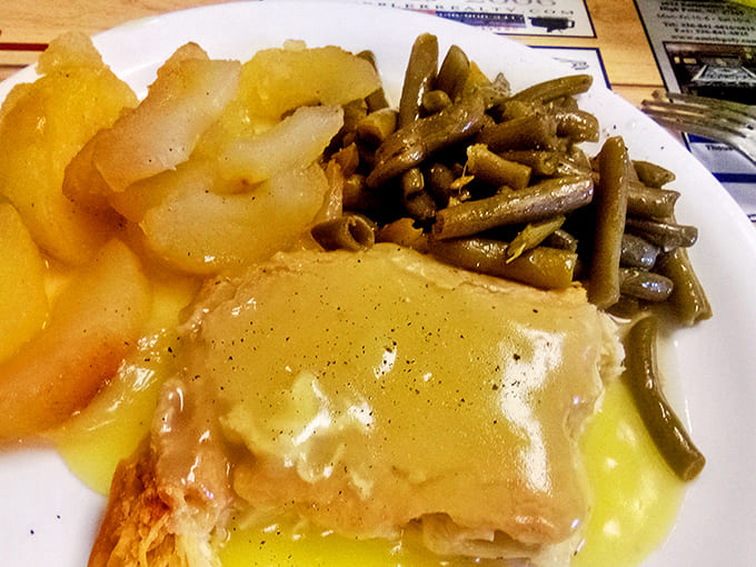 This isn't just food&mdash;it's edible Southern history. Tender greens swimming alongside gravy-smothered goodness that demands to be savored.